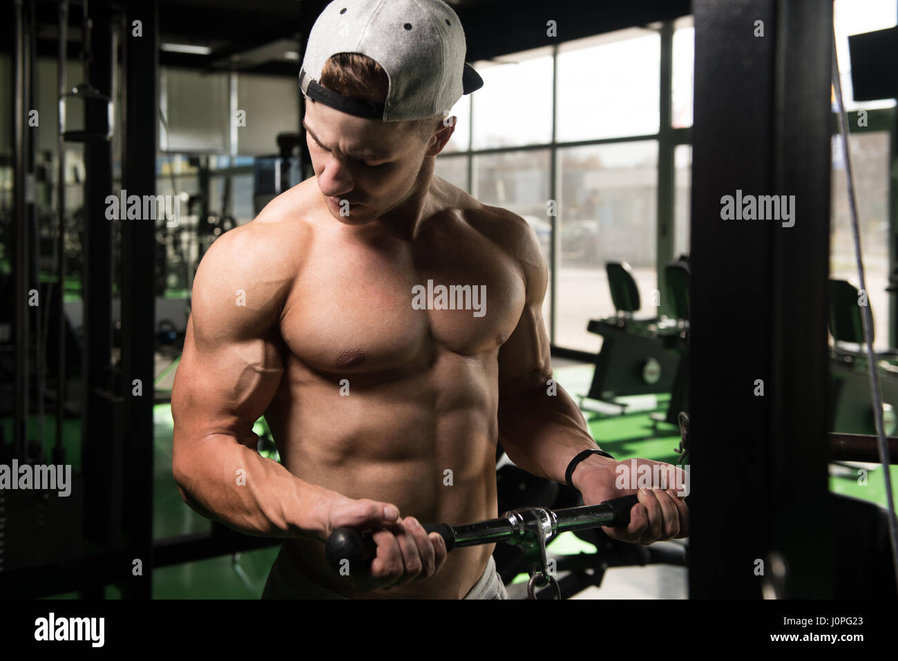 Handsome Muscular Fitness Bodybuilder Doing Heavy Weight Exercise For ...