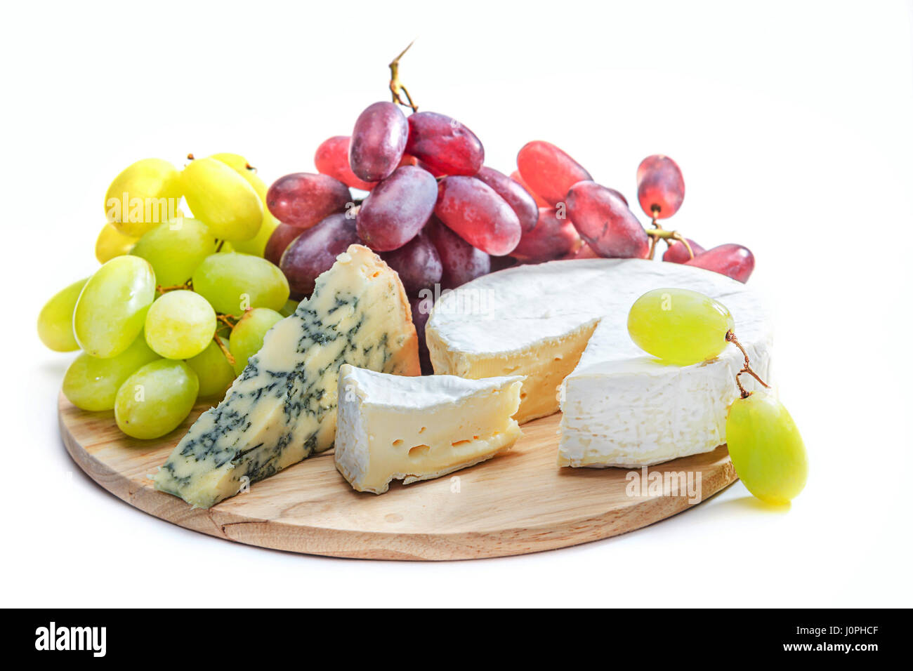 nice cheese board with grapes on white background Stock Photo - Alamy