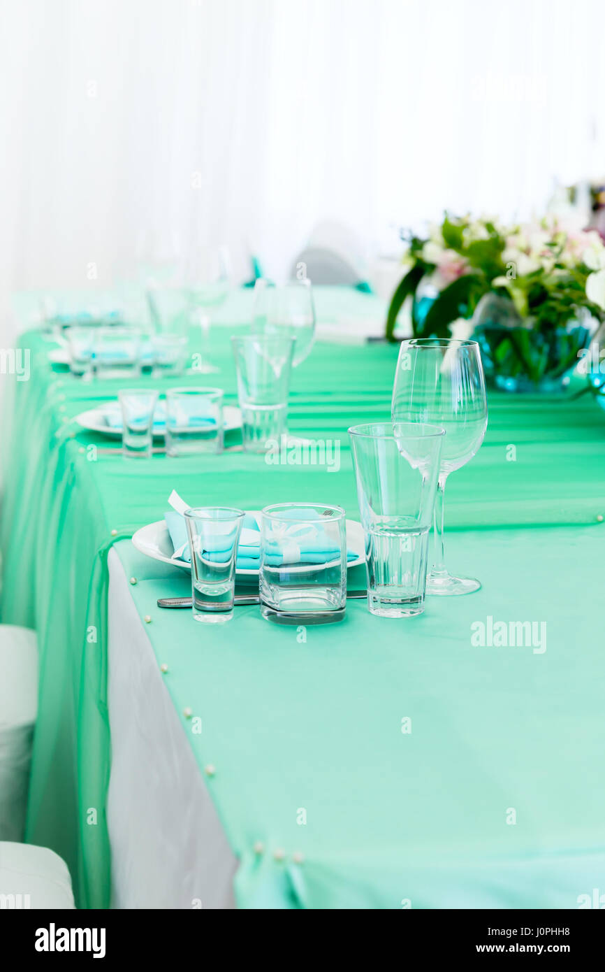 Served table layout green color Stock Photo - Alamy