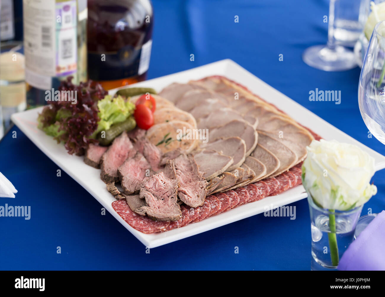 Mix of meat snack on a plate fresh slices Stock Photo - Alamy