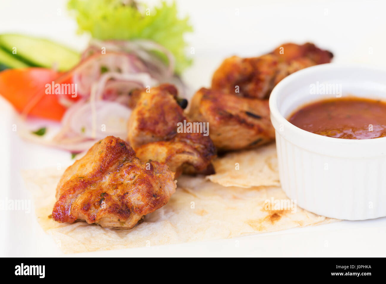 Pork bbq barbecue on a plate Stock Photo - Alamy