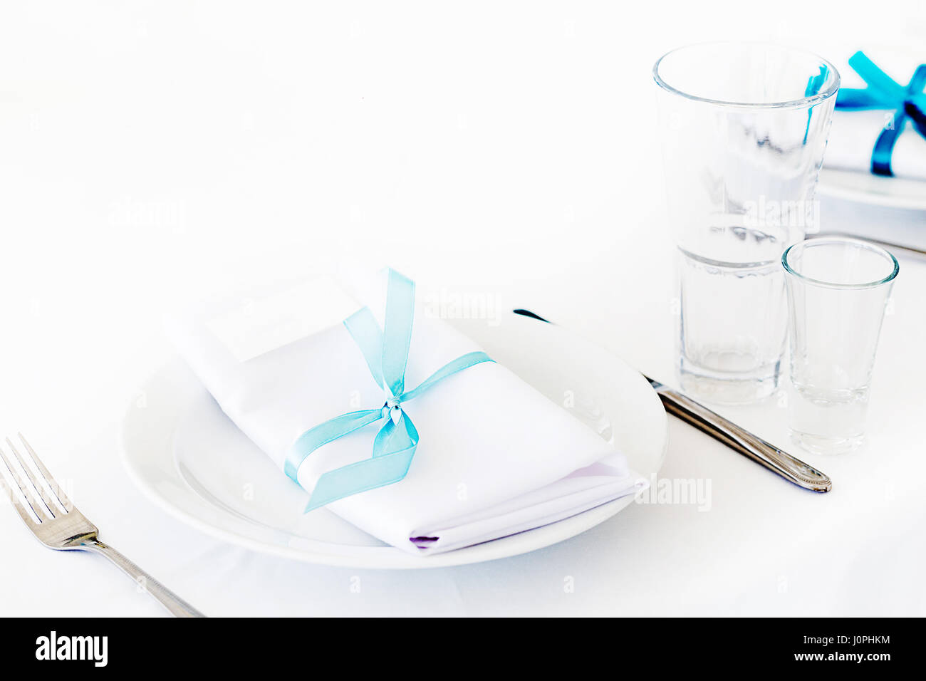 Wedding birthday perfect white table layout on table Stock Photo - Alamy
