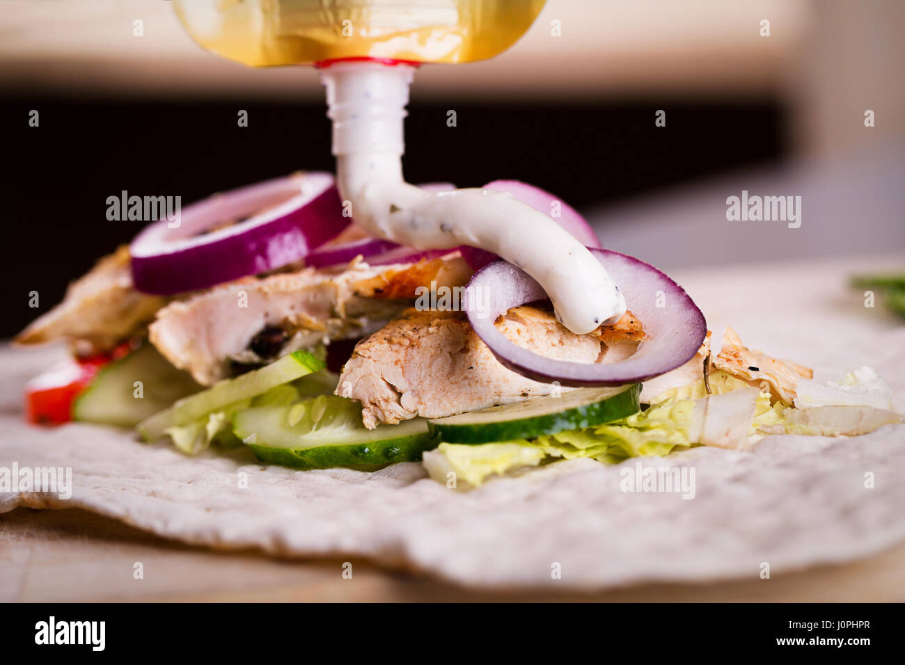 Fresh homemade chicken wrap tortilla in process Stock Photo - Alamy