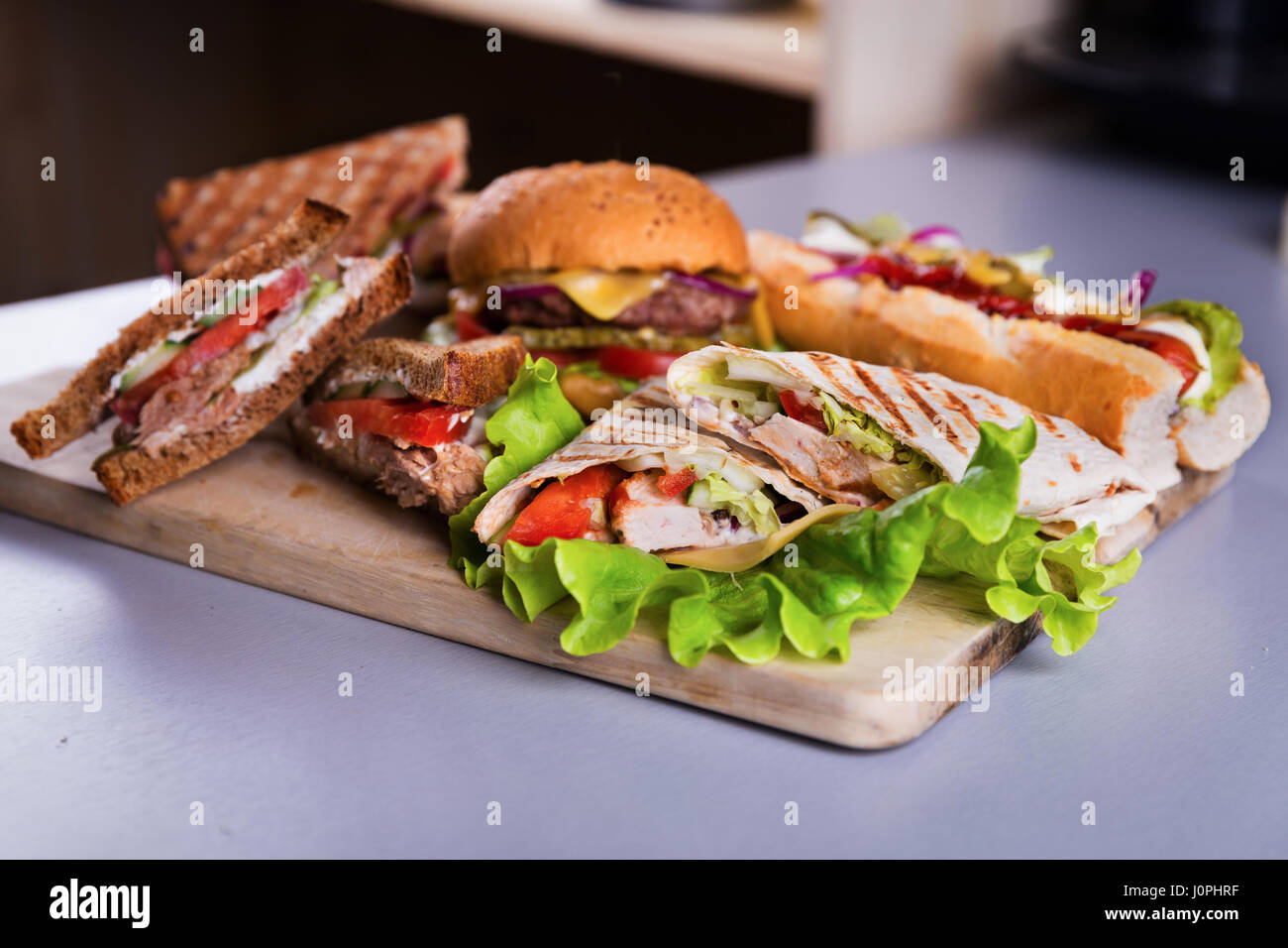 Fast food plate with burger hot dog sandwiches and chicken wrap Stock ...
