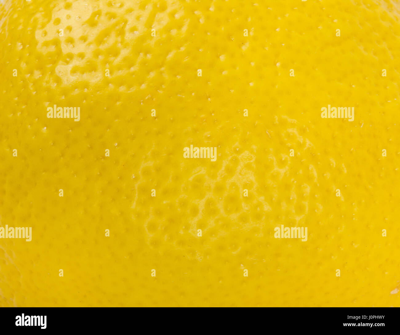 Lemon citrus fruit texture close yellow background Stock Photo - Alamy