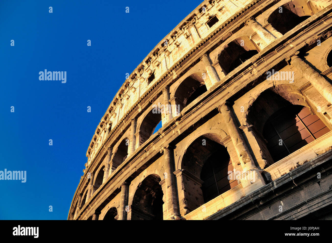 The grand Coliseum in Rome during the golden hour of late afternoon ...