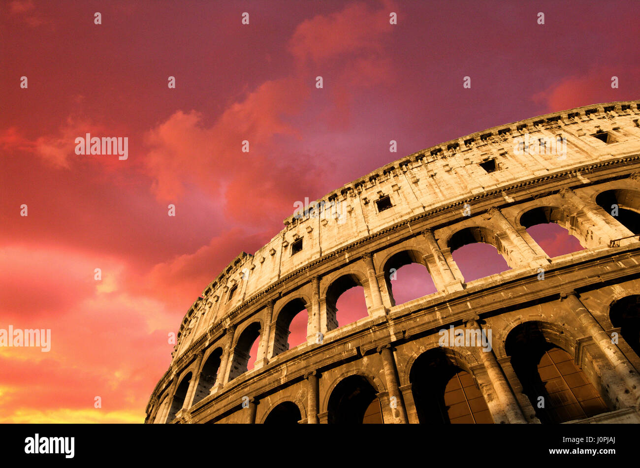 Majestic Coliseum under a dramatic sky in Rome, showcasing timeless ...