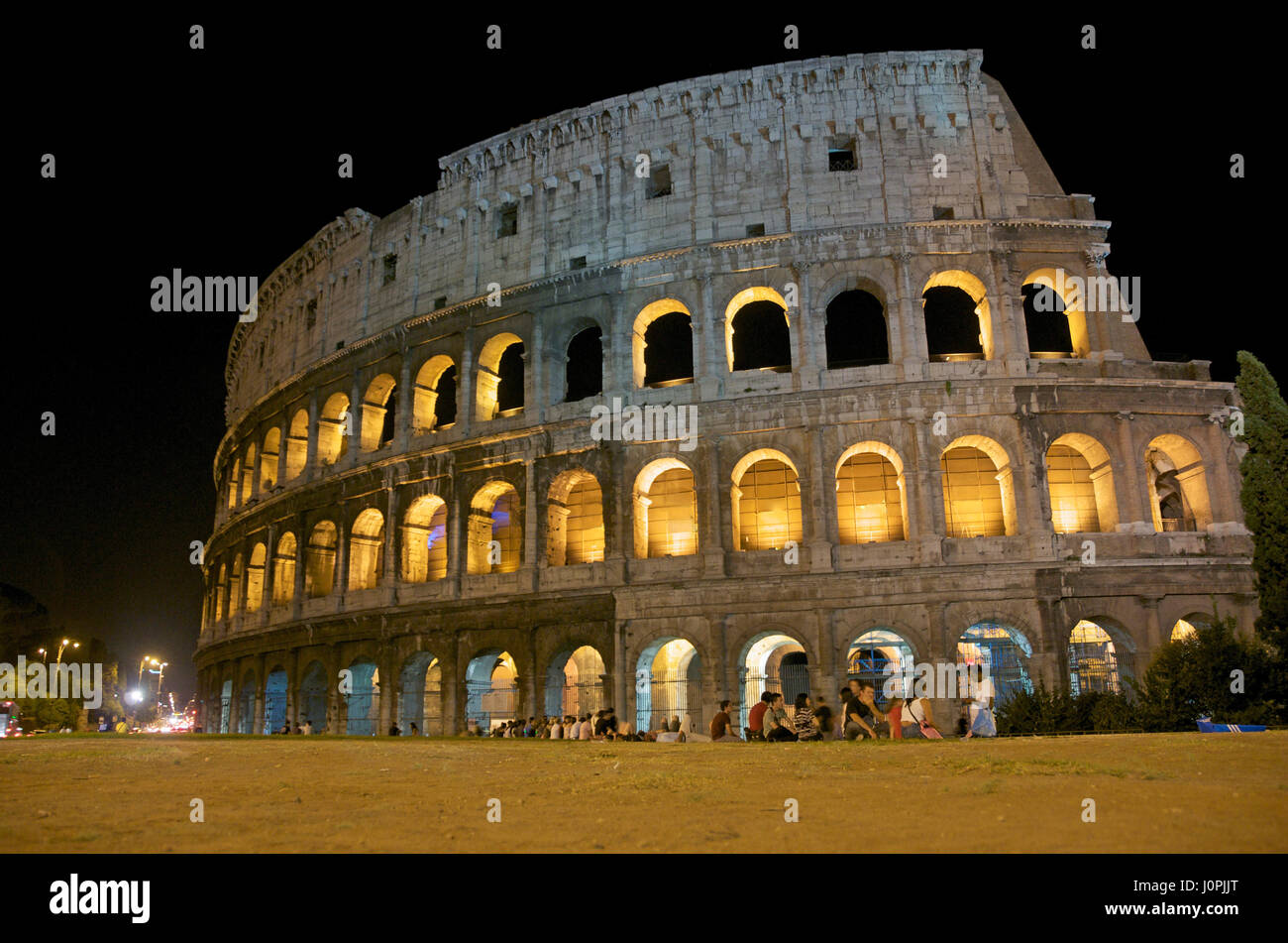 Coliseum illuminated at night showcasing the grandeur of ancient Rome ...