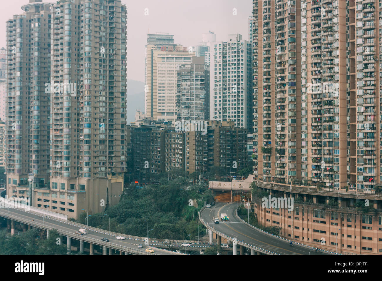 Chongqing, China - Dec 22, 2015: The view of foggy crowded city beside ...