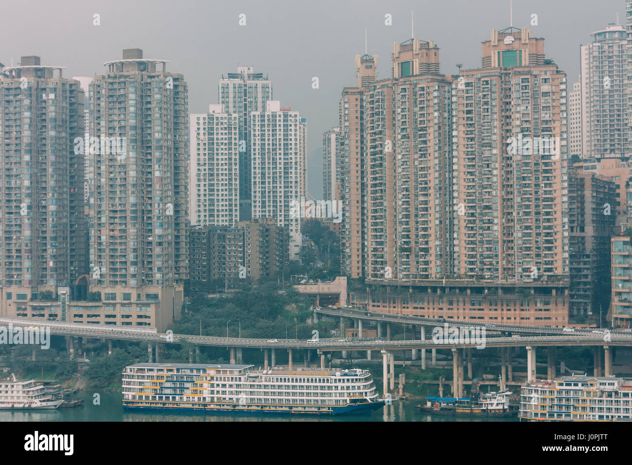Chongqing, China - Dec 22, 2015: The view of foggy crowded city beside ...