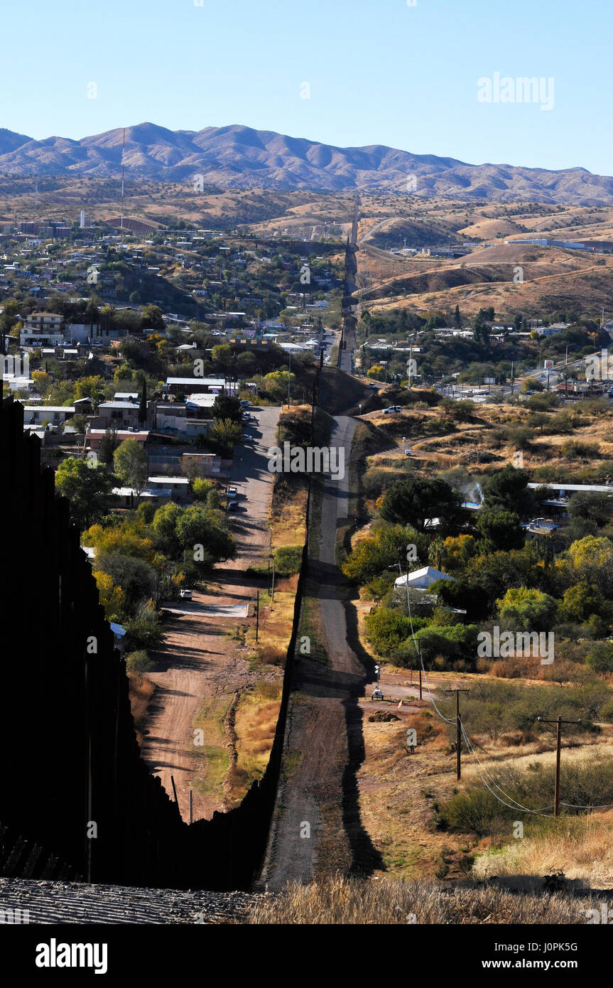 A wall indicates the international border between Nogales, Sonora ...