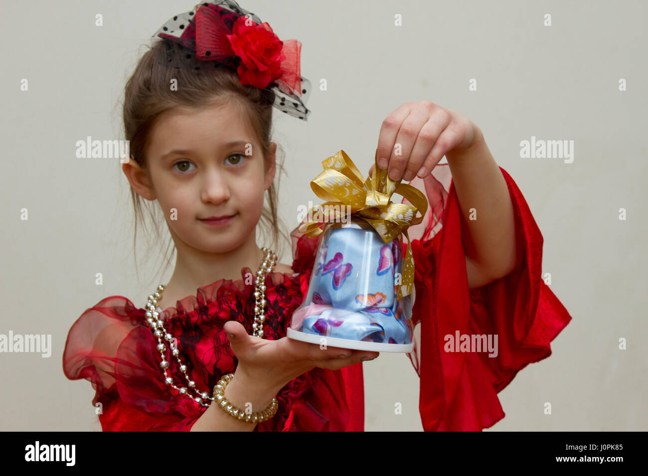 happy child holding a present Stock Photo - Alamy