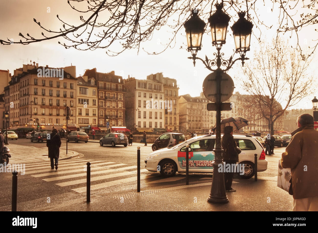 Street on sunset during a rain. Paris. France Stock Photo - Alamy