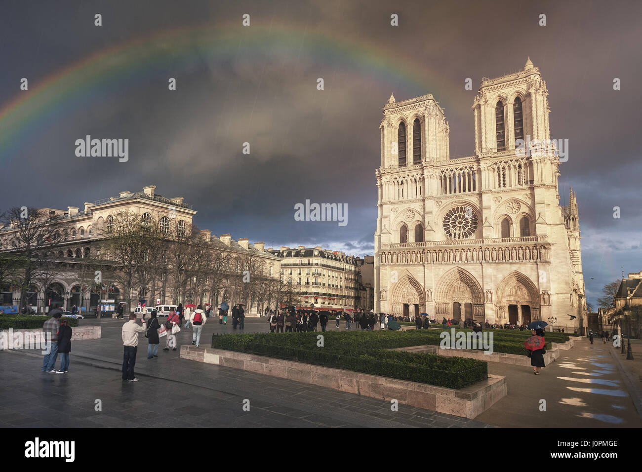 Rain and a rainbow over Cathédrale Notre-Dame de Paris. France Stock ...