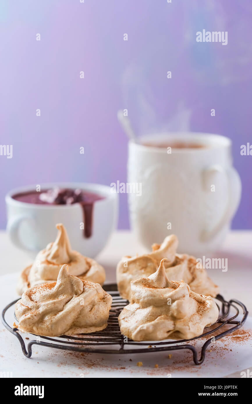 Coffee meringues with chocolate sauce Stock Photo - Alamy