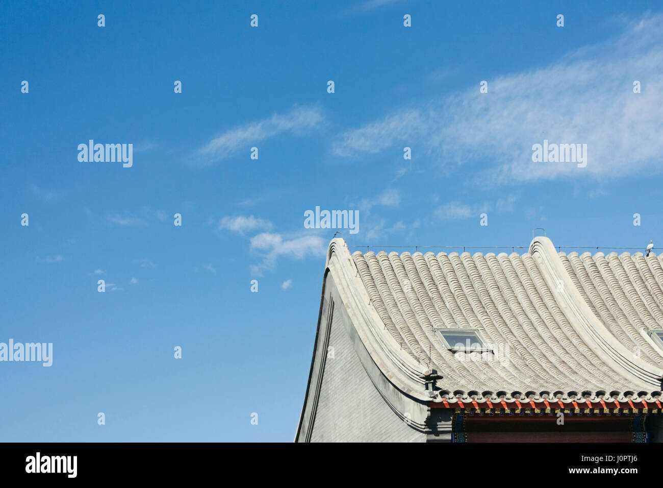 Close-up details of traditional Chinese building roofs with blue sky ...