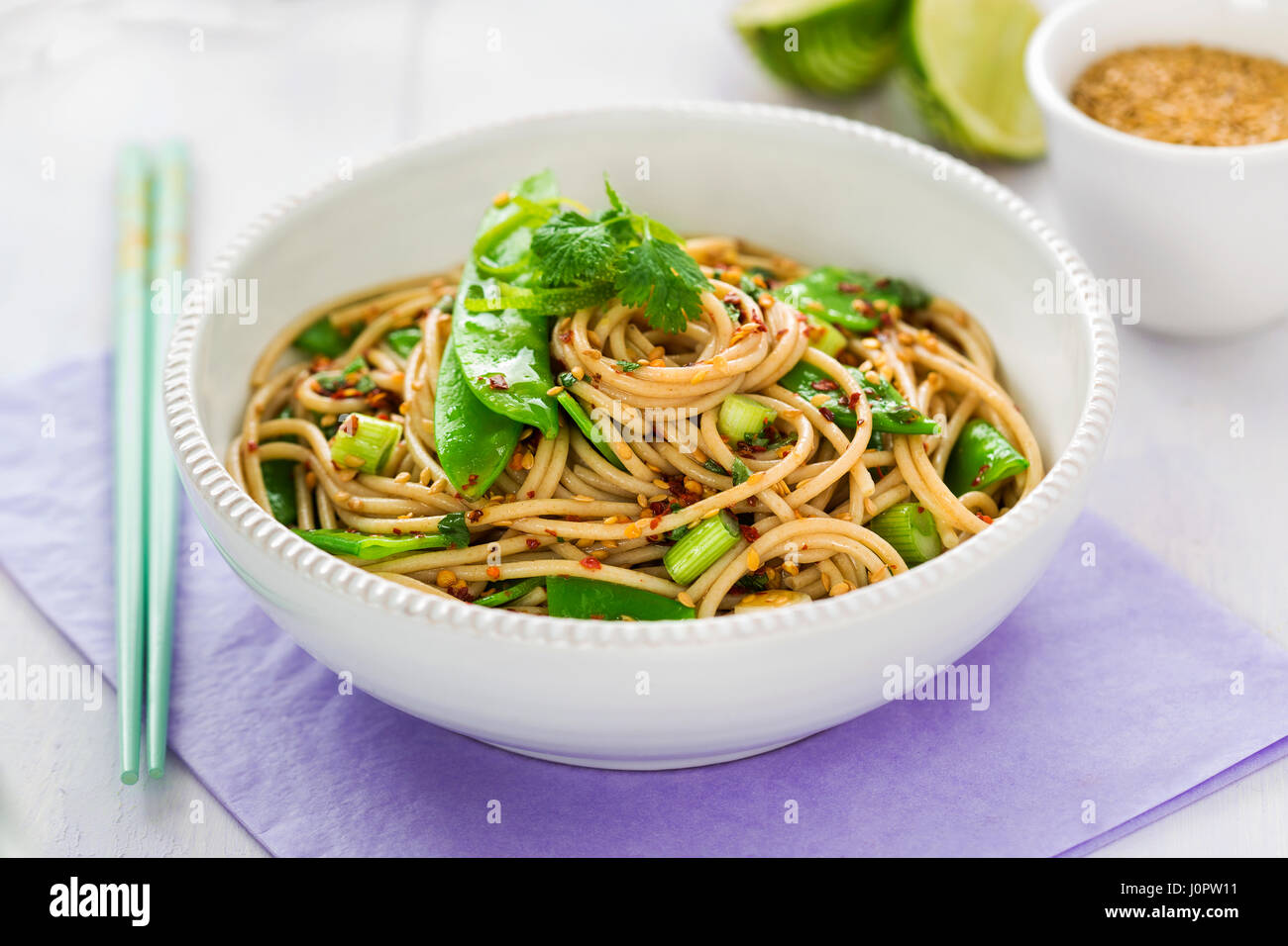 Sesame spaghetti with pea and scallions Stock Photo - Alamy