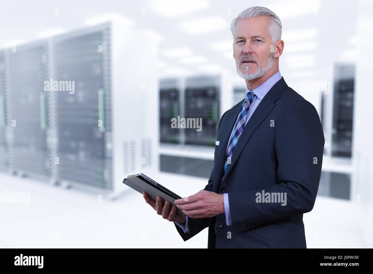 Portrait of senior businessman in big rack server room Stock Photo - Alamy