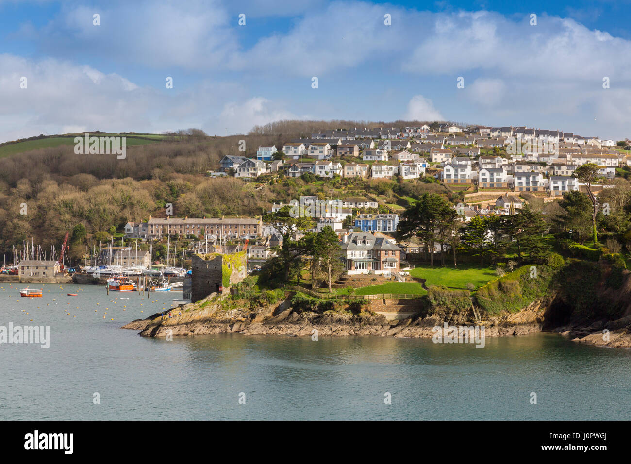 Looking across the Fowey River to the historic port of Polruan with its ...