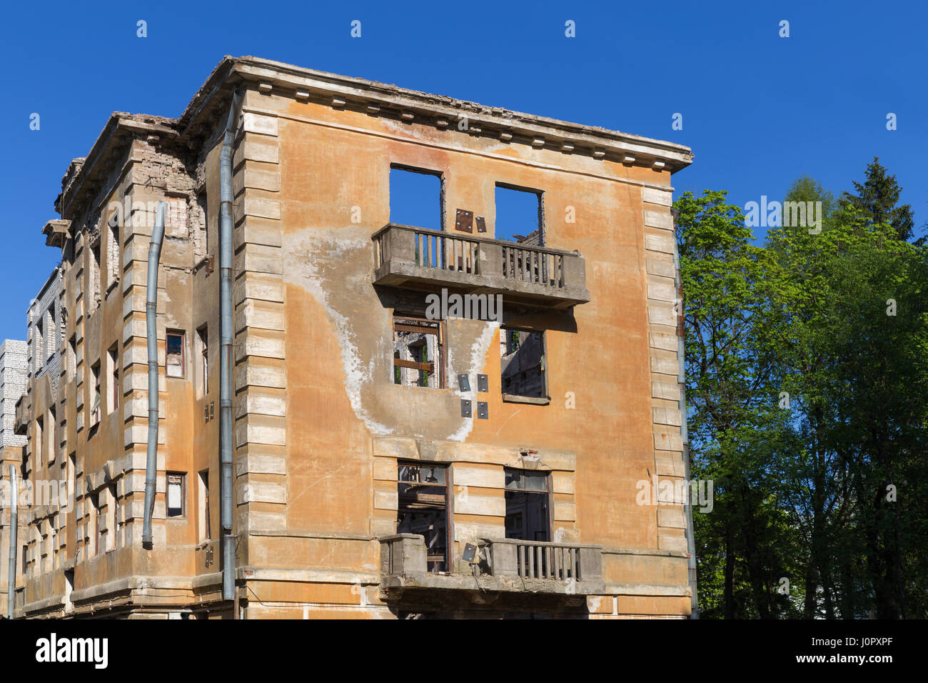 Abandoned building - broken tenement apartment house in daylight Stock ...