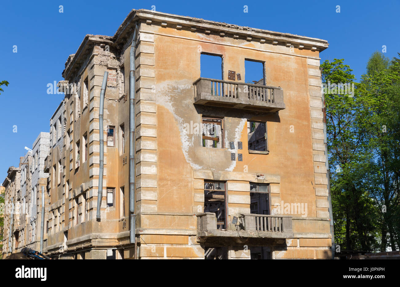 Abandoned building - broken tenement apartment house in daylight Stock ...