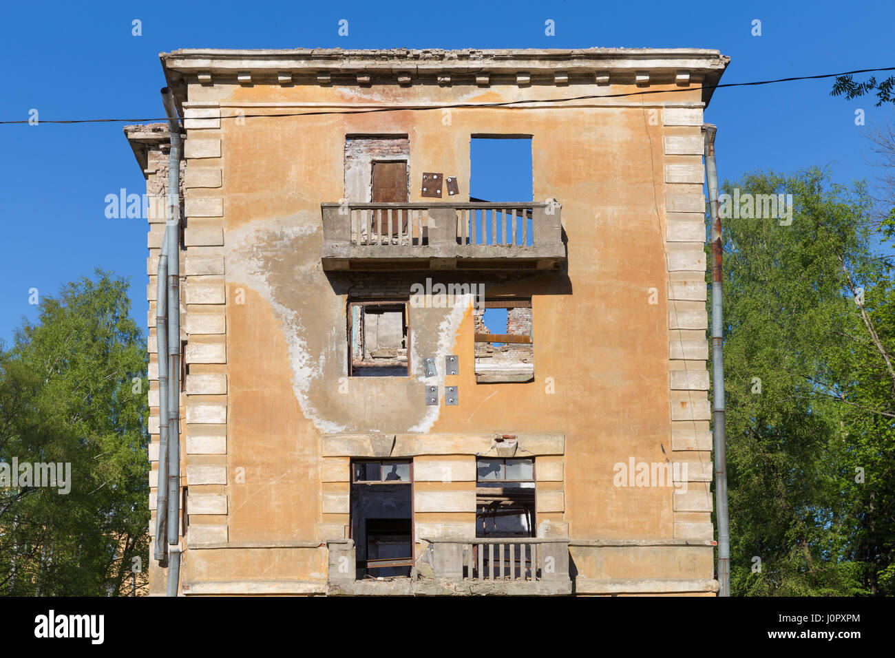 Abandoned building - broken tenement apartment house in daylight Stock ...