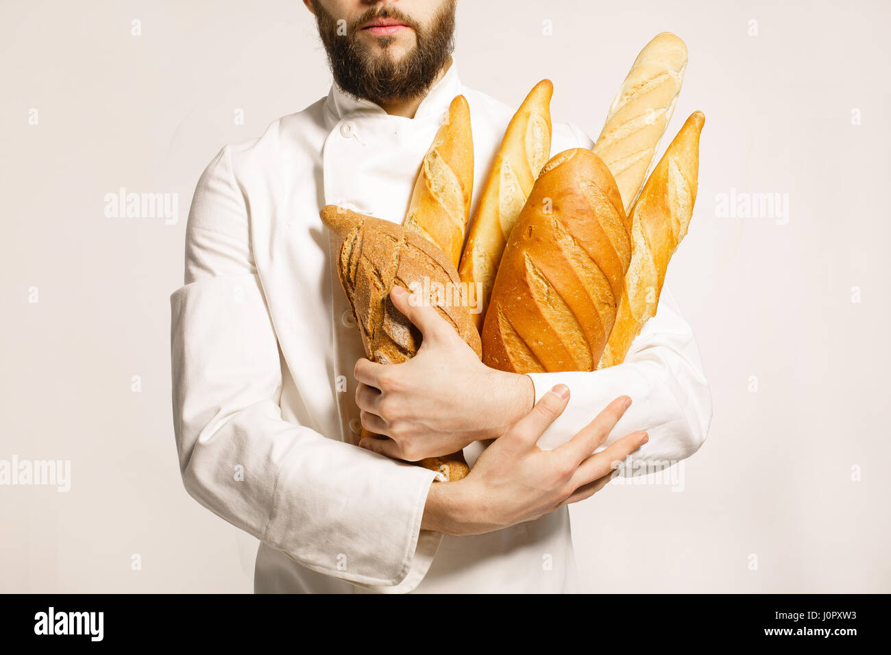 Holding a loaf of bread in his hands hi-res stock photography and ...