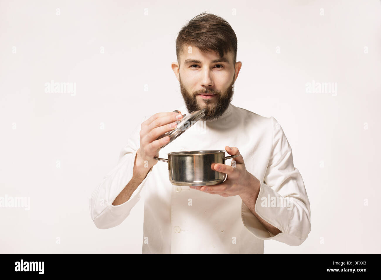 Chef smelling aroma from saucepan Stock Photo - Alamy