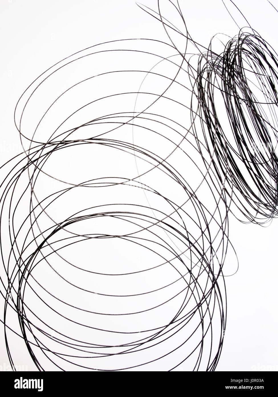 Tangled thin wire. On white background Stock Photo - Alamy