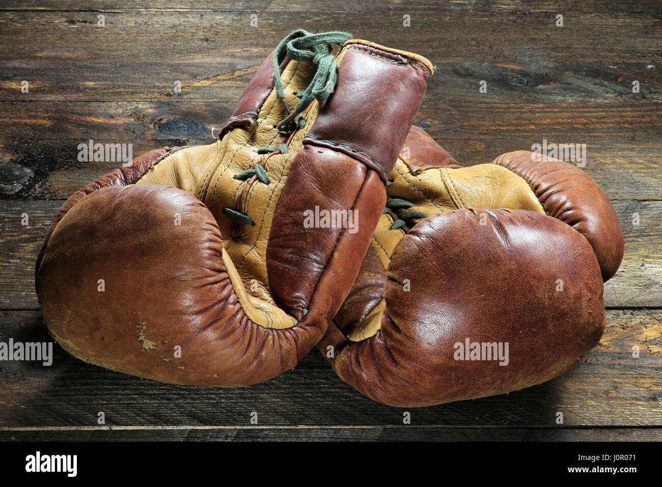 vintage boxing gloves on wooden background Stock Photo - Alamy