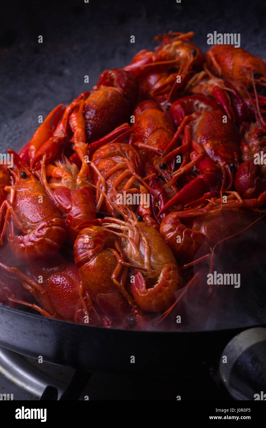 Crayfish are being cooked on a frying pan Stock Photo - Alamy