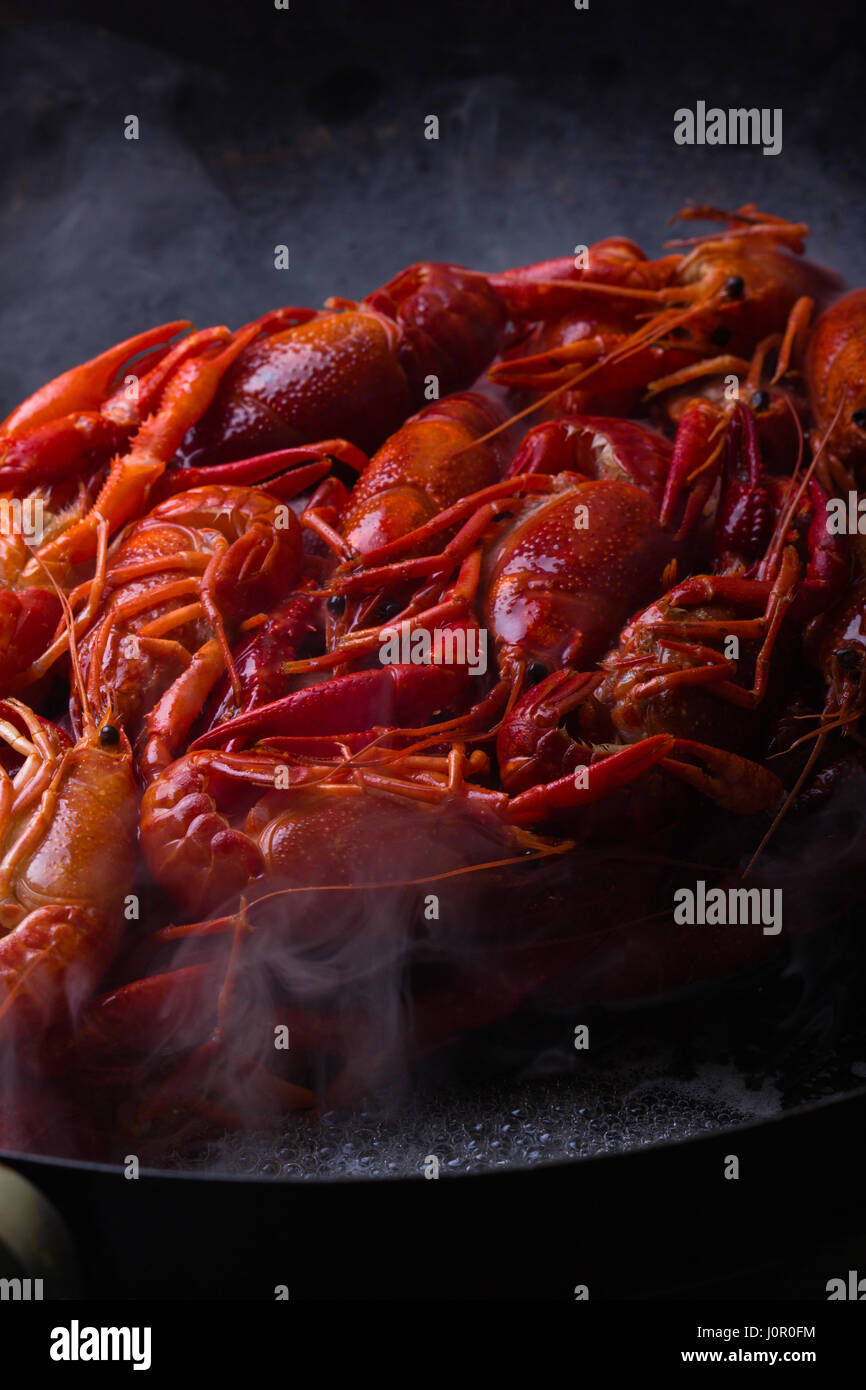 Crayfish are being cooked on a frying pan Stock Photo - Alamy