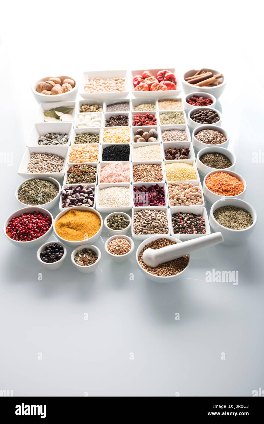 Spices and leguminous vegetables in bowls, isolated on white background ...