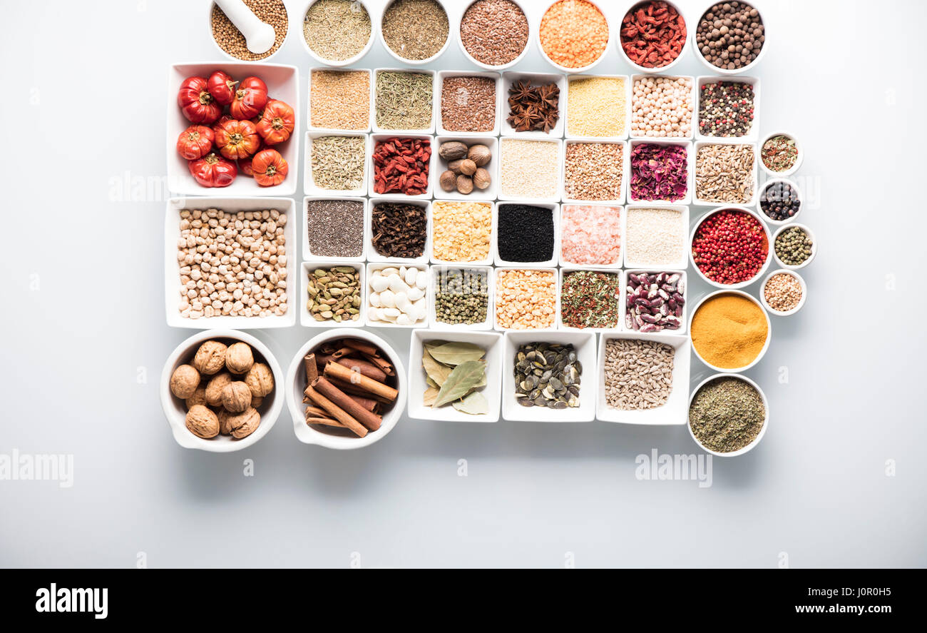 Spices and leguminous vegetables in bowls, isolated on white background ...