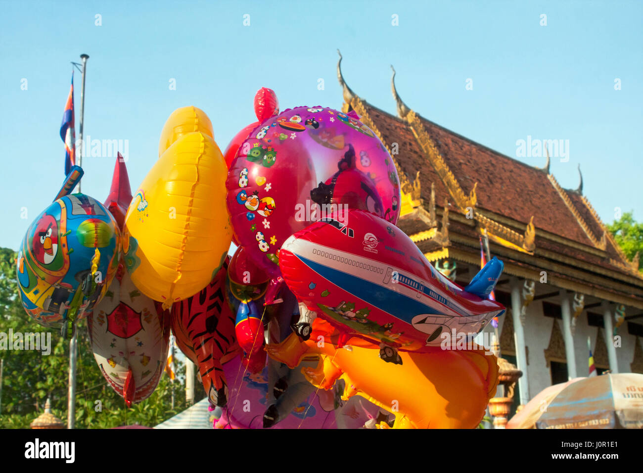 Toy balloons are at a traditional Khmer New Year celebration at a ...