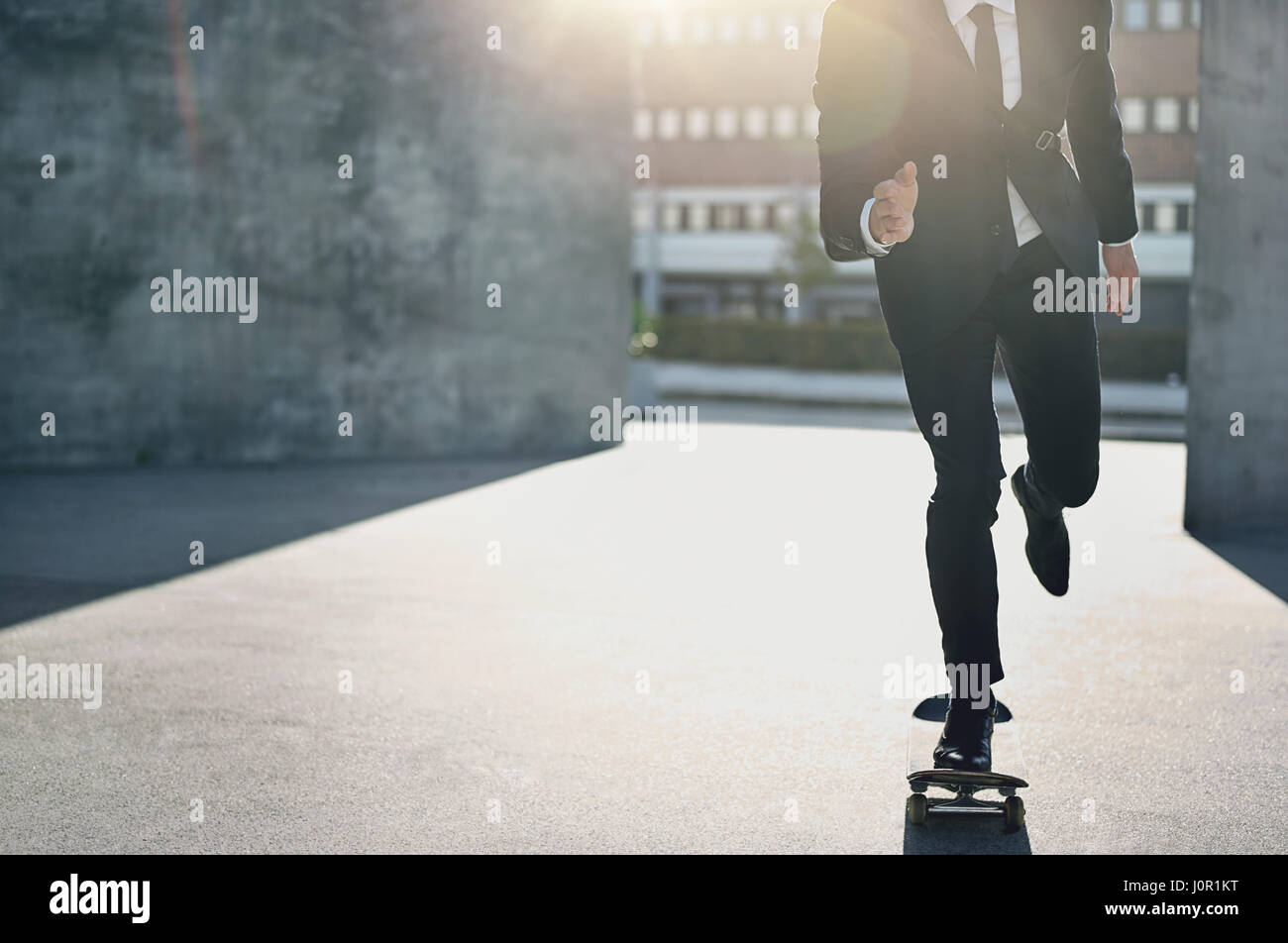 Horizontal crop shot of a businessman wearing formal suit riding a ...