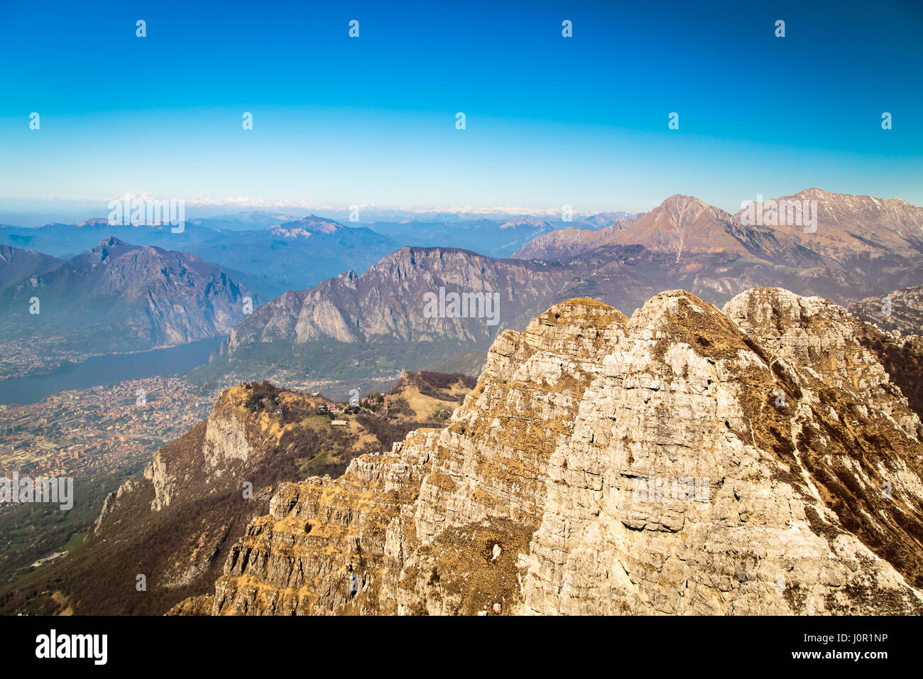 The lake of Como with the city of Lecco and the mountains behind in a ...