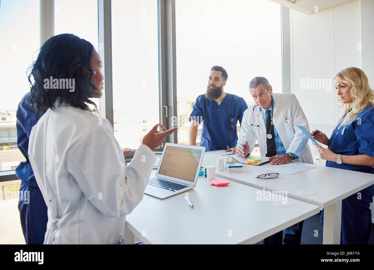 Team of doctors communicating during brief in the clinic at hospital ...