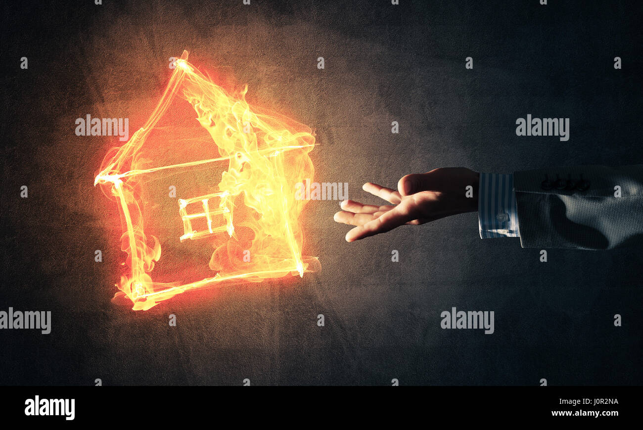 Businessman hand pointing at burning fire symbol Stock Photo - Alamy