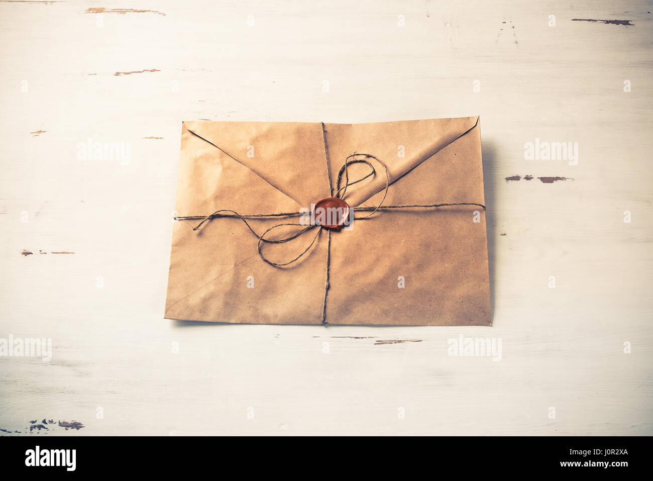 Letter with seal on table Stock Photo - Alamy