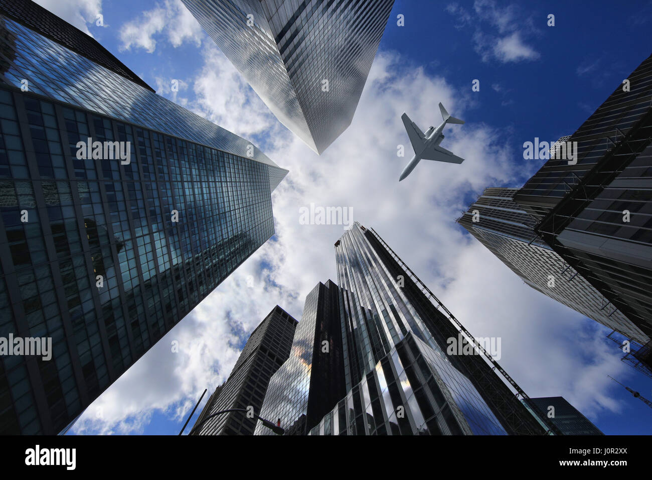 Airplane between buildings hi-res stock photography and images - Alamy