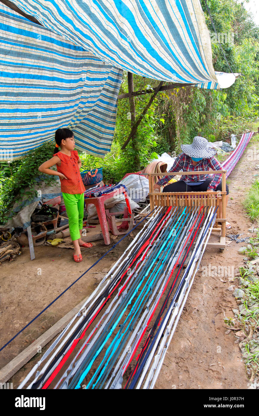 Woman weaving mat hi-res stock photography and images - Alamy