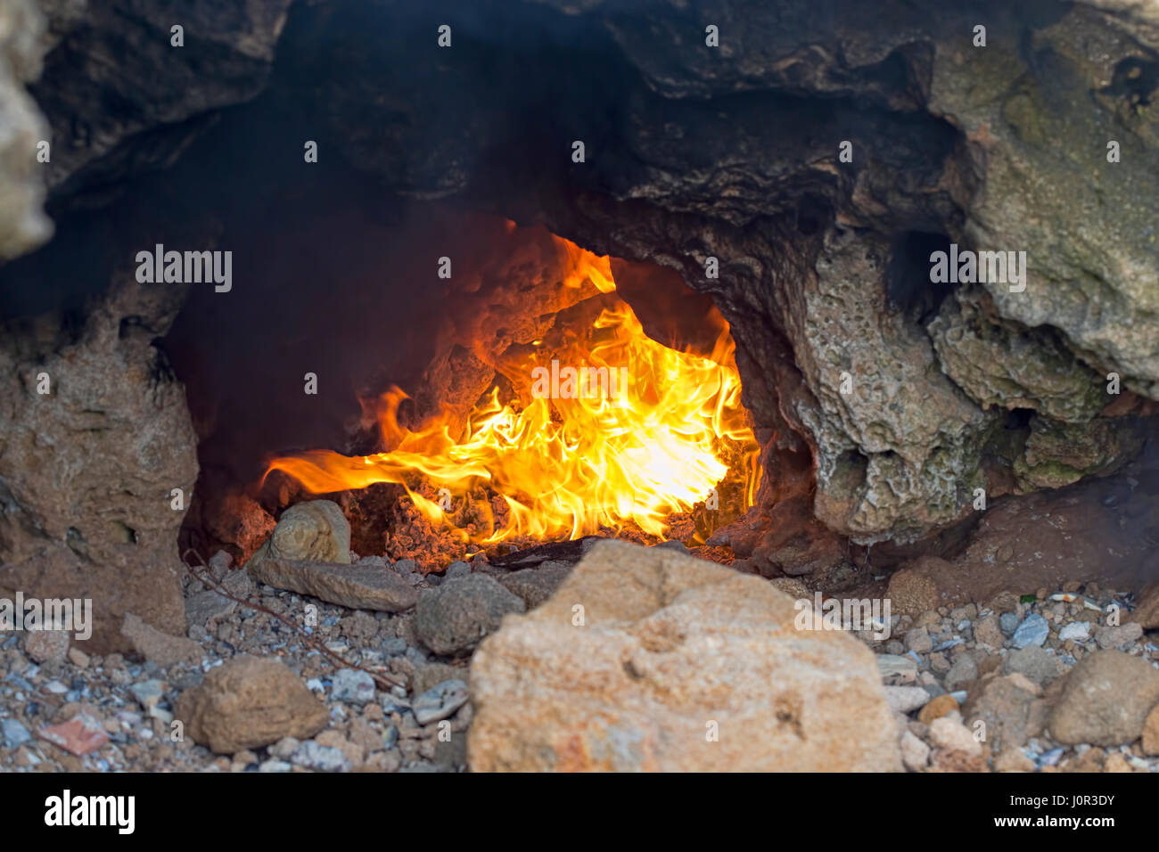 Fire in cave, by the shore, Moroccan village Stock Photo - Alamy