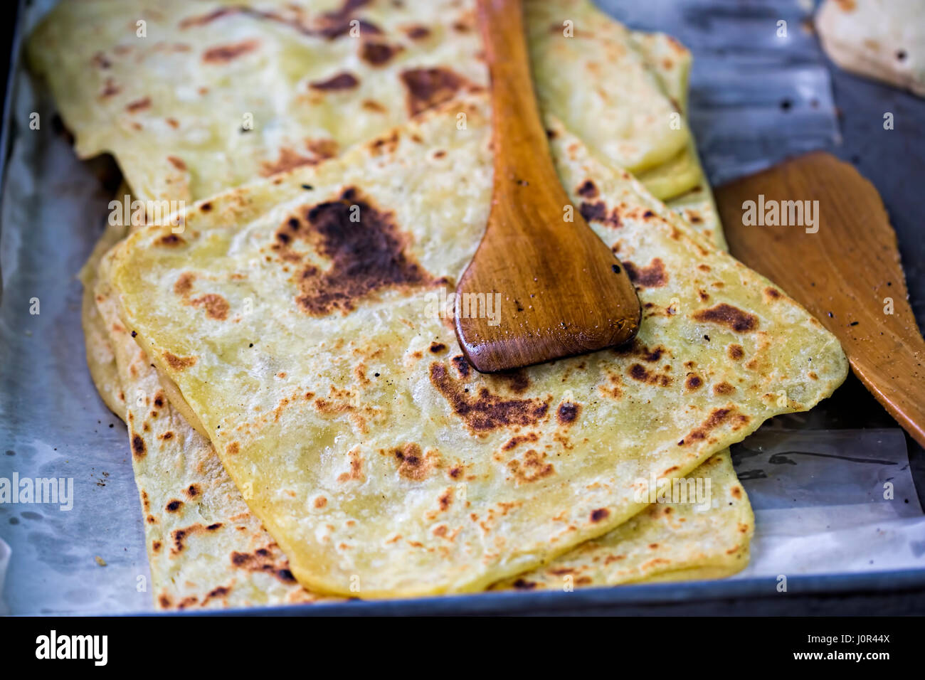 Moroccan Msemen. Square flatbread prepared on the grill, Marrakech ...