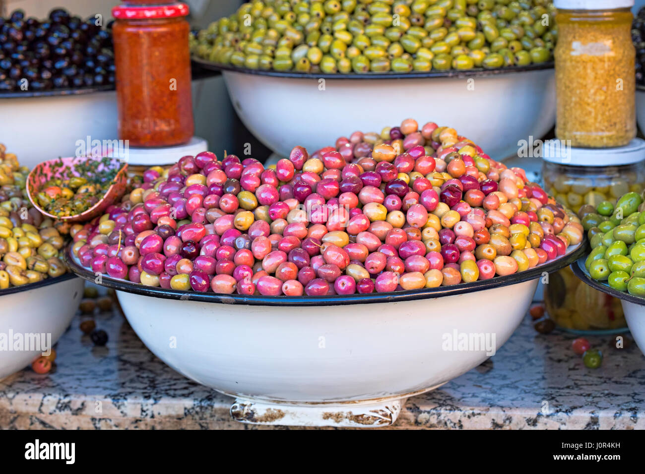 Selection of olives, red olives on Moroccan food stall, Marrakesh ...