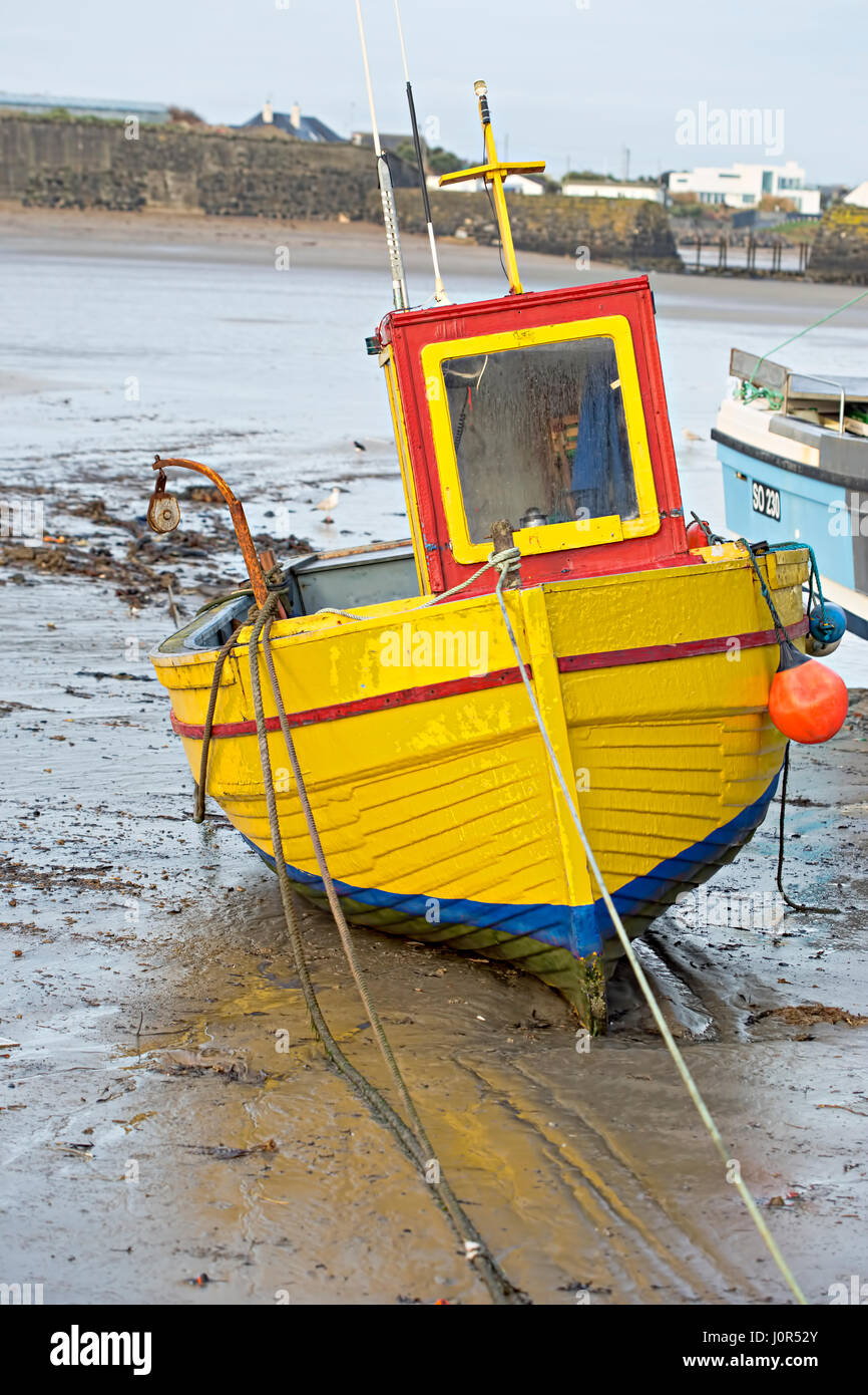 Yellow boat on the beach Stock Photo - Alamy