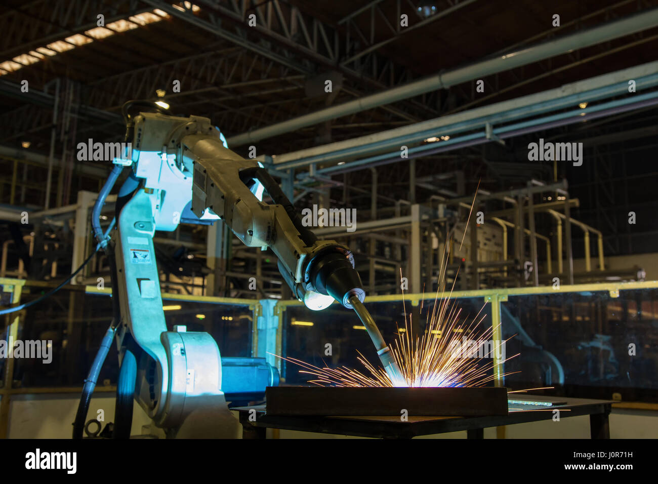Robot is welding steel in factory Stock Photo - Alamy