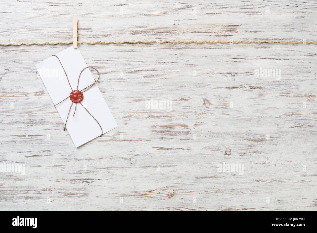 Mail envelope on rope Stock Photo - Alamy