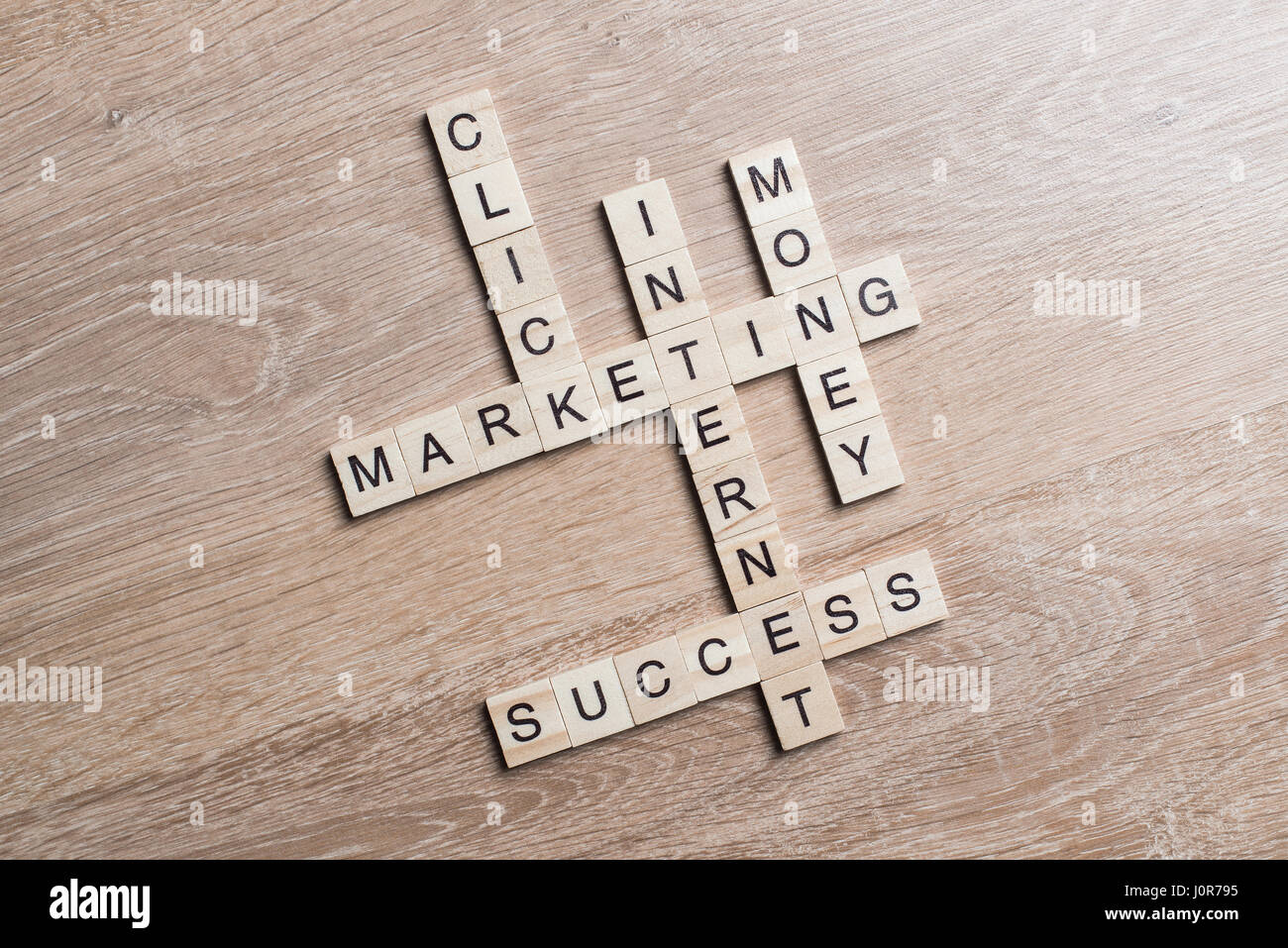 Conceptual business keywords on table with elements of game making ...