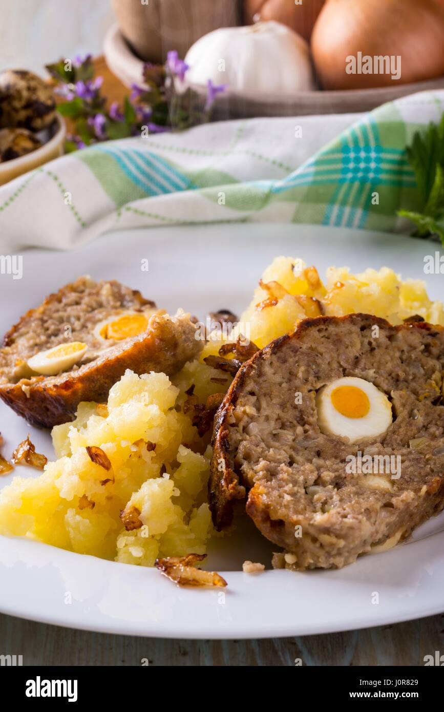 Vertical photo with two slices of homemade Easter meatloaf which is ...